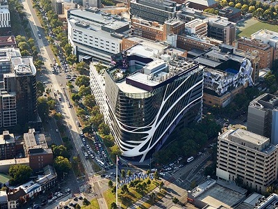 Melbourne cancer care facility sky signs stand out against striking ...