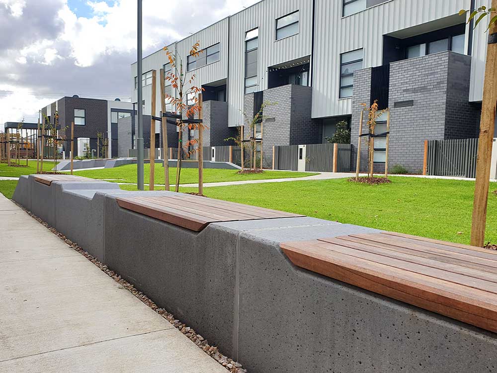 Bespoke concrete bench seats wrap around garden spaces at Altona North ...