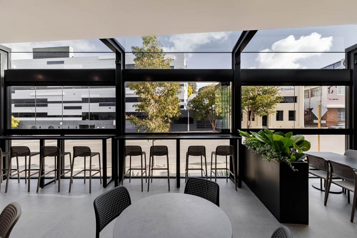 Stacking glass windows allow year-round use of alfresco space at ...