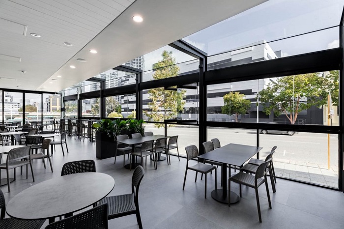 Stacking glass windows allow year-round use of alfresco space at ...