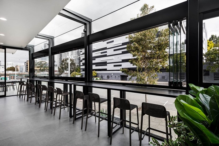 Stacking glass windows allow year-round use of alfresco space at ...