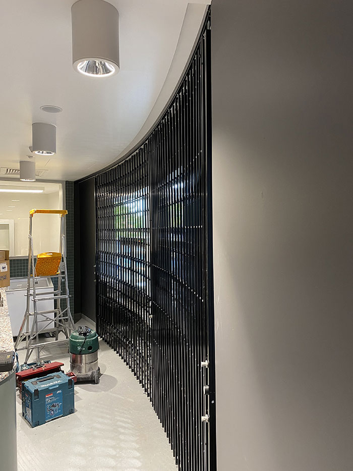 Visually appealing curved folding doors secure UniSQ’s Ipswich Campus ...