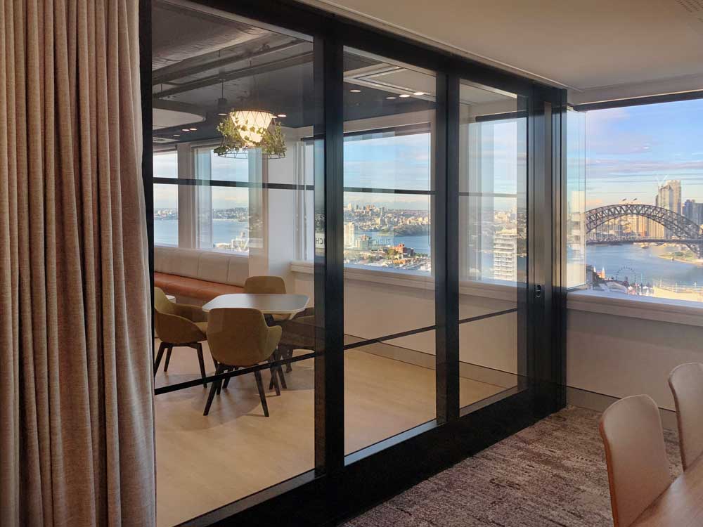 Glass operable wall in Minetek’s new Sydney office provides see-through ...