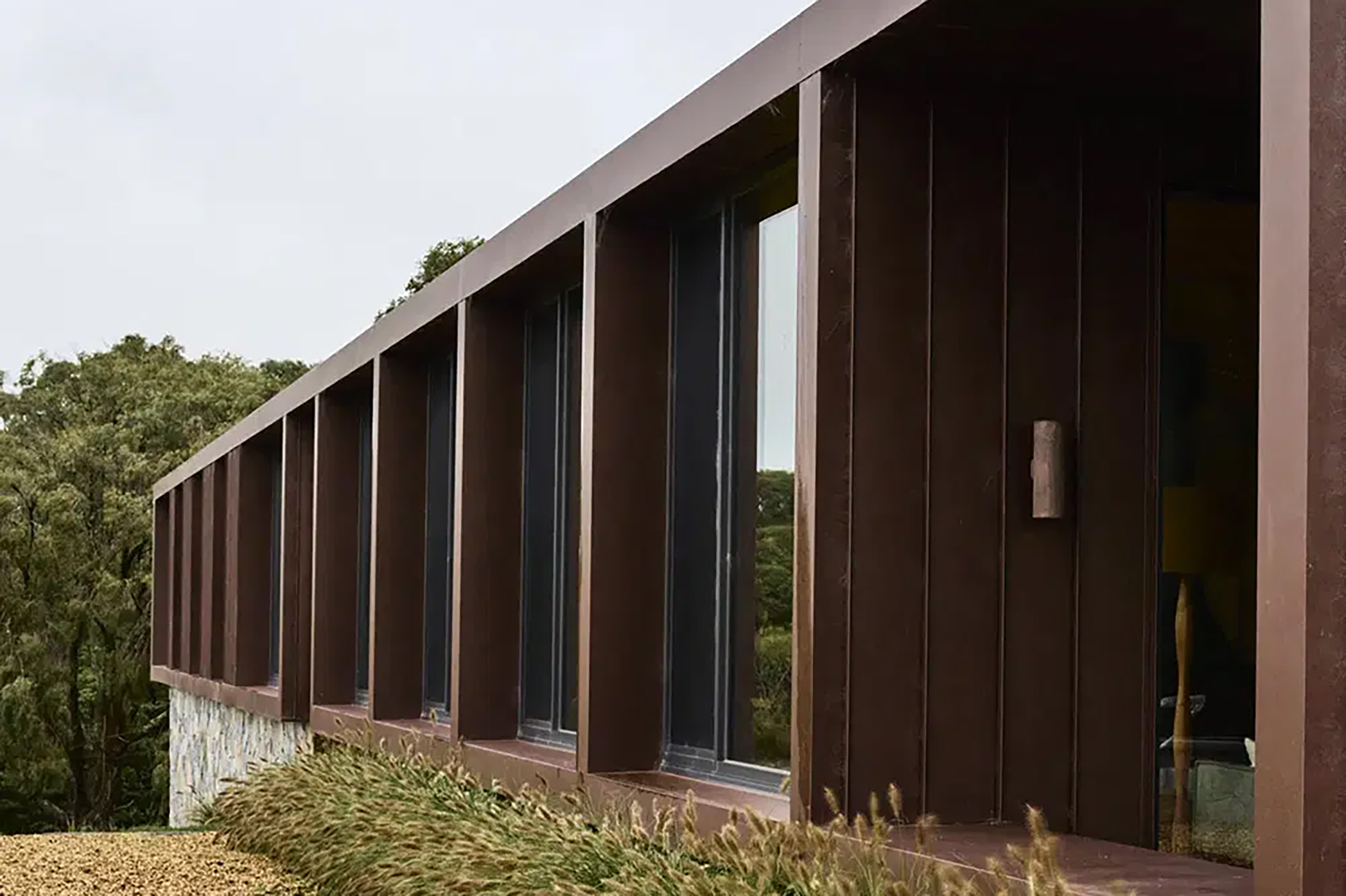 Naturally weathered steel finish achieved with UniCote LUX Corten Red ...