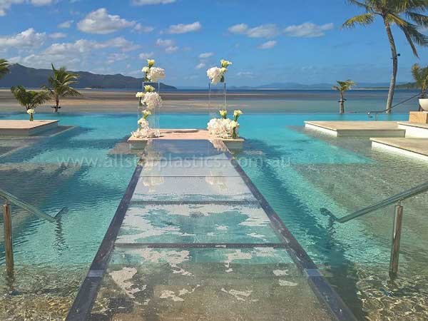 Runway created over resort pool for wedding using 25mm Plexiglas sheet ...