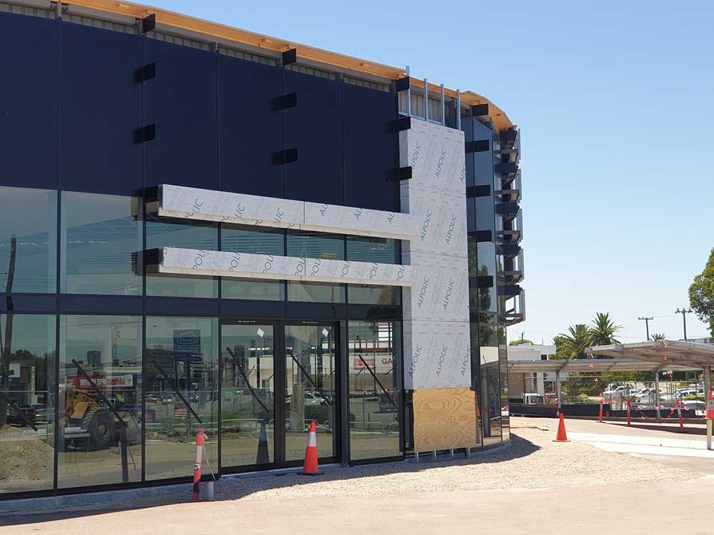 Fire safe Mitsubishi ALPOLIC cladding at luxury Porsche dealership ...