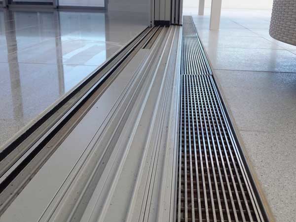 Stainless steel level threshold drains providing seamless transition ...