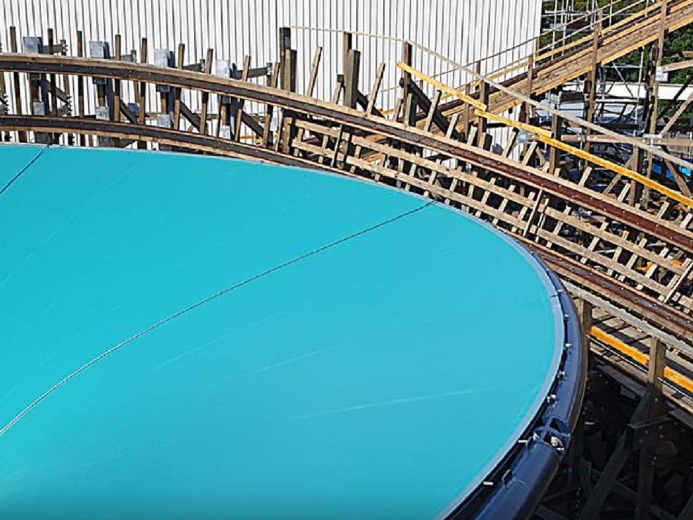 Visitors queue up for thrilling Sea World Leviathan ride under funnel ...