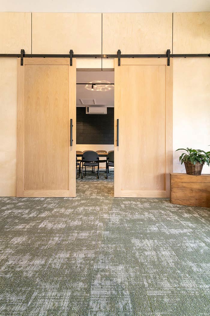 Diverse material palette with carpet tiles adds biophilic vibe in ...